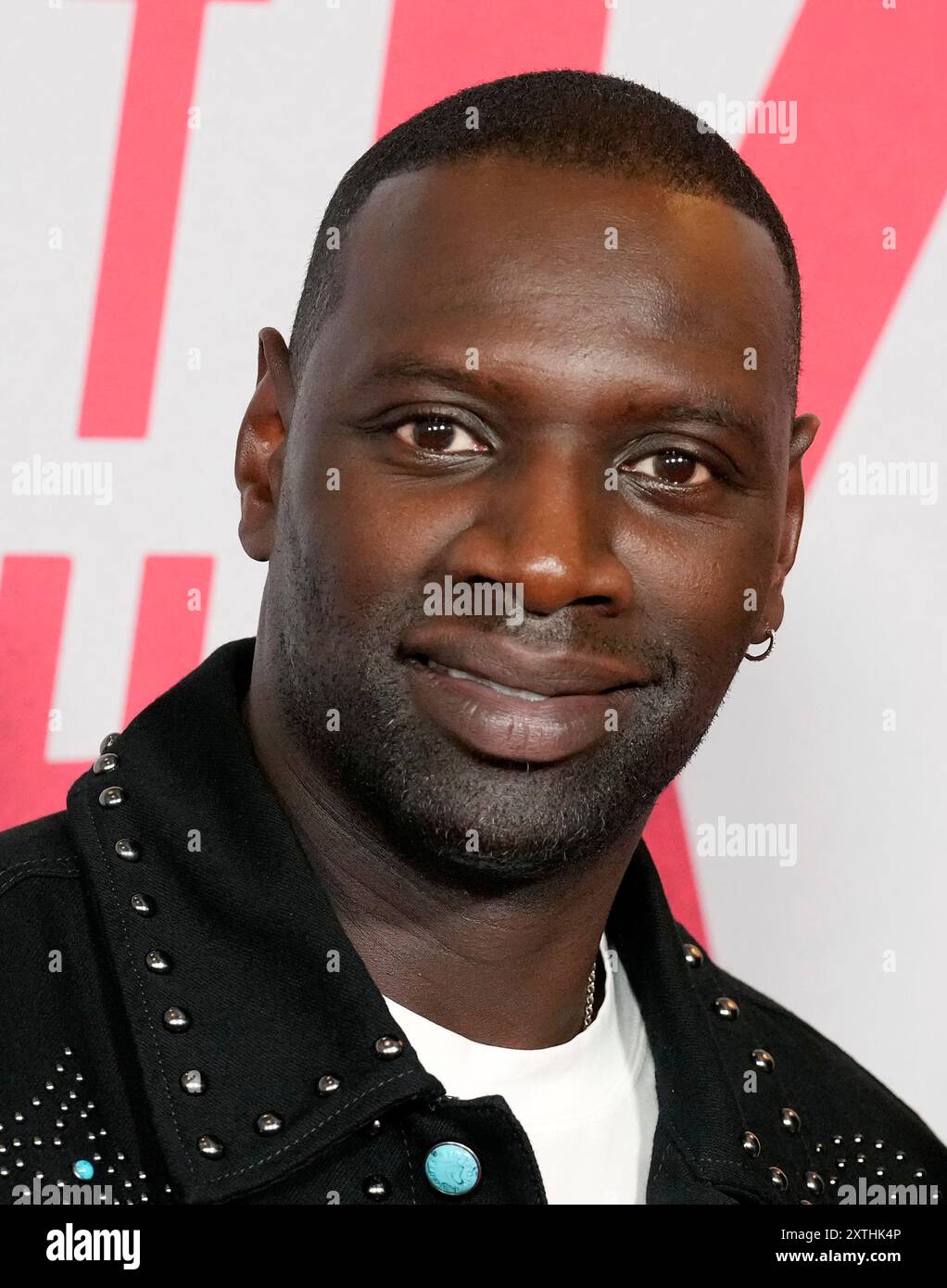 Omar Sy poses at the premiere of the Peacock film "The Killer," at the ...