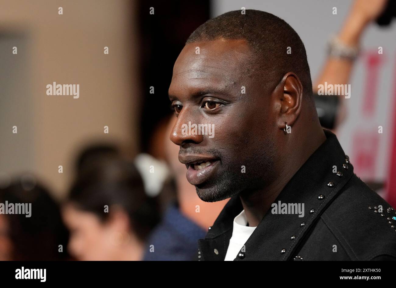 Omar Sy is interviewed at the premiere of the Peacock film "The Killer ...