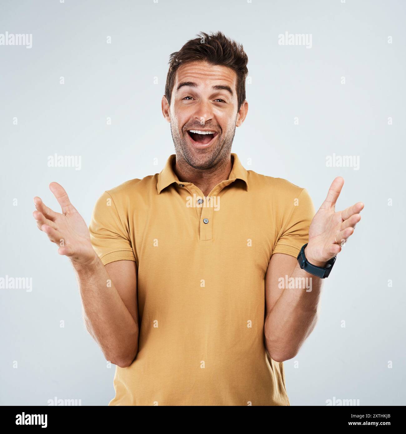 Surprise, portrait and wow with hand gesture of happy man in studio on ...