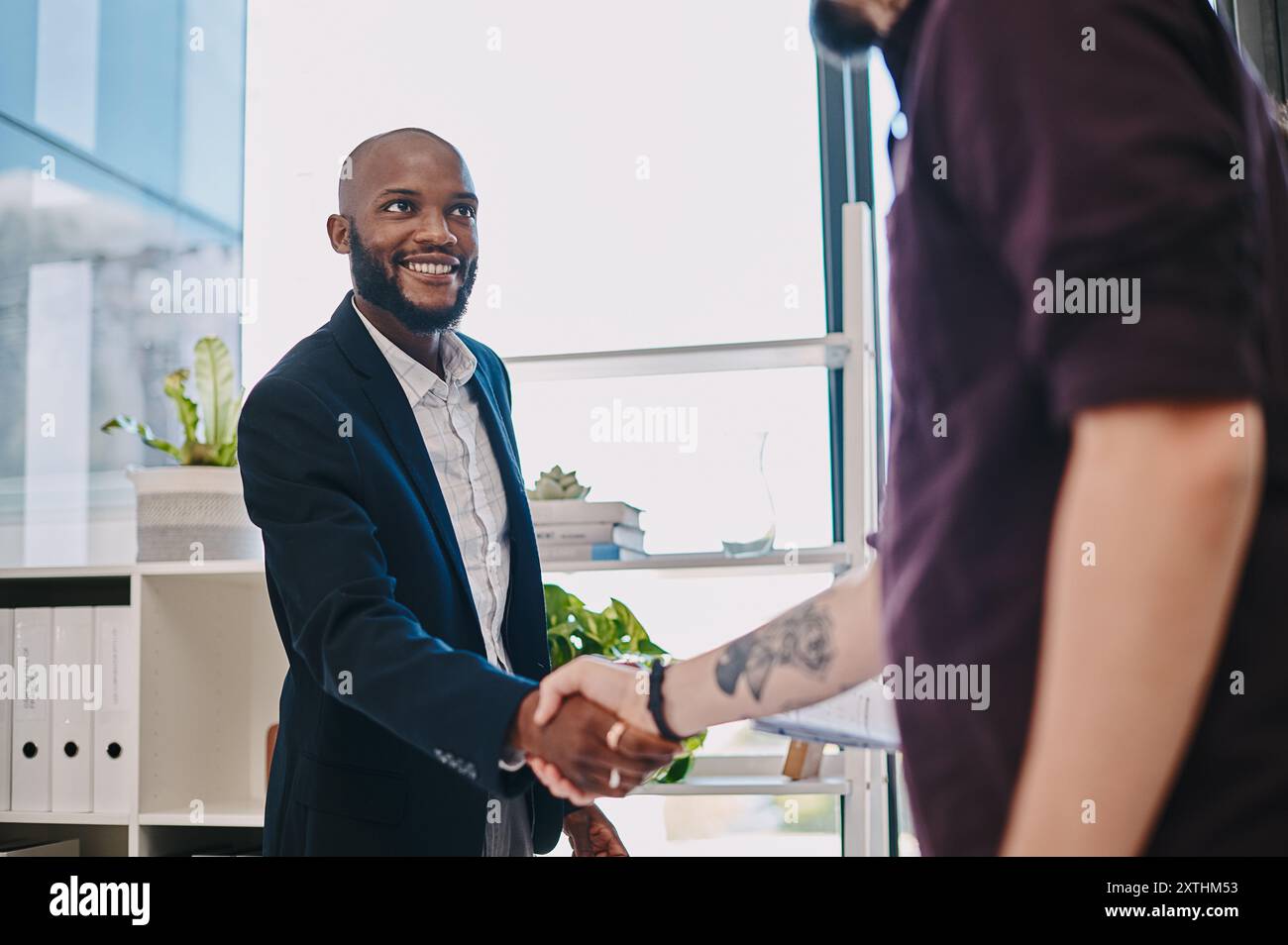 Business, man and shaking hands in office for welcome, greeting and introduction with smile. B2b ...
