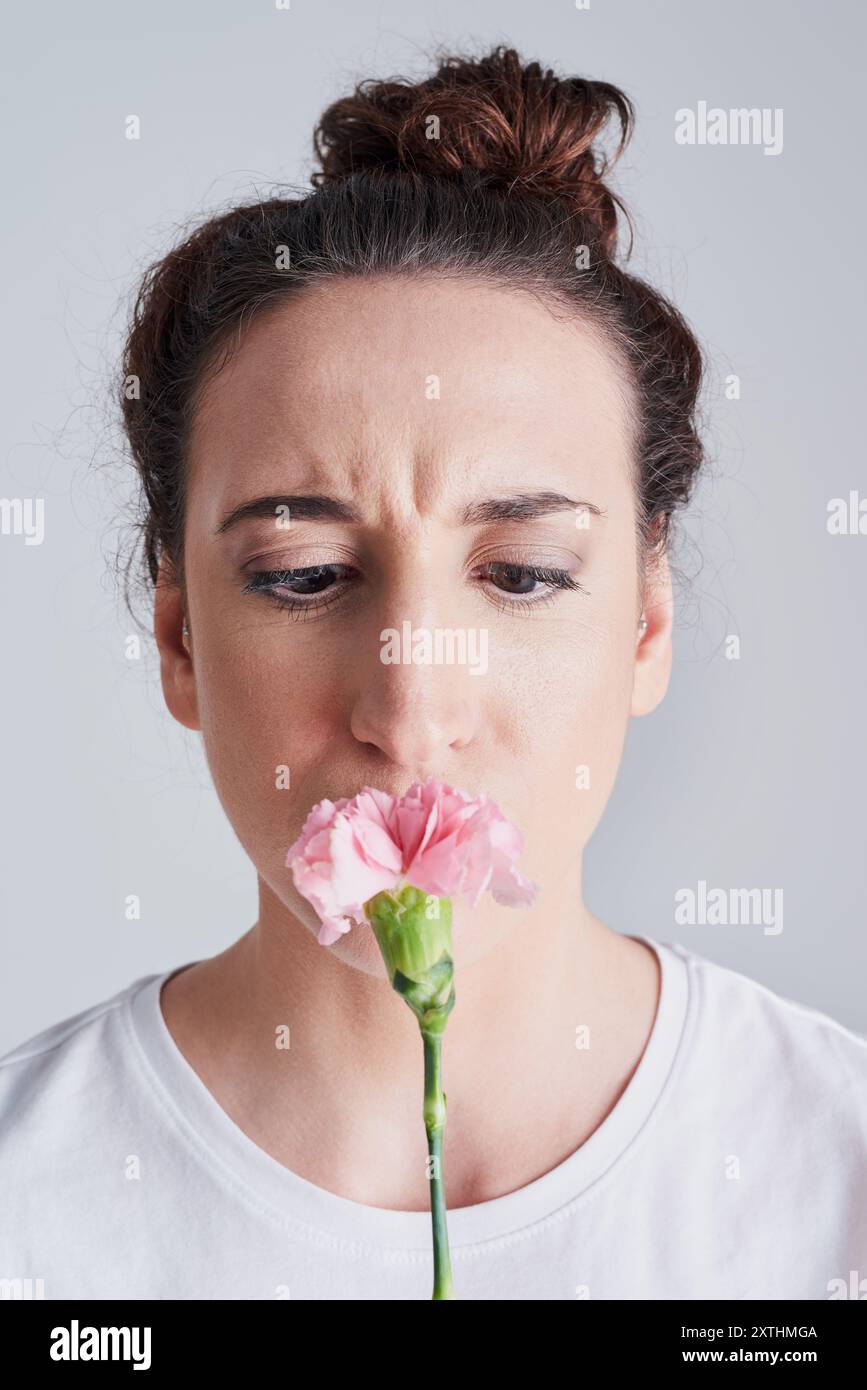 Nature, woman and smell flower in studio for bloom season, wellness and ...