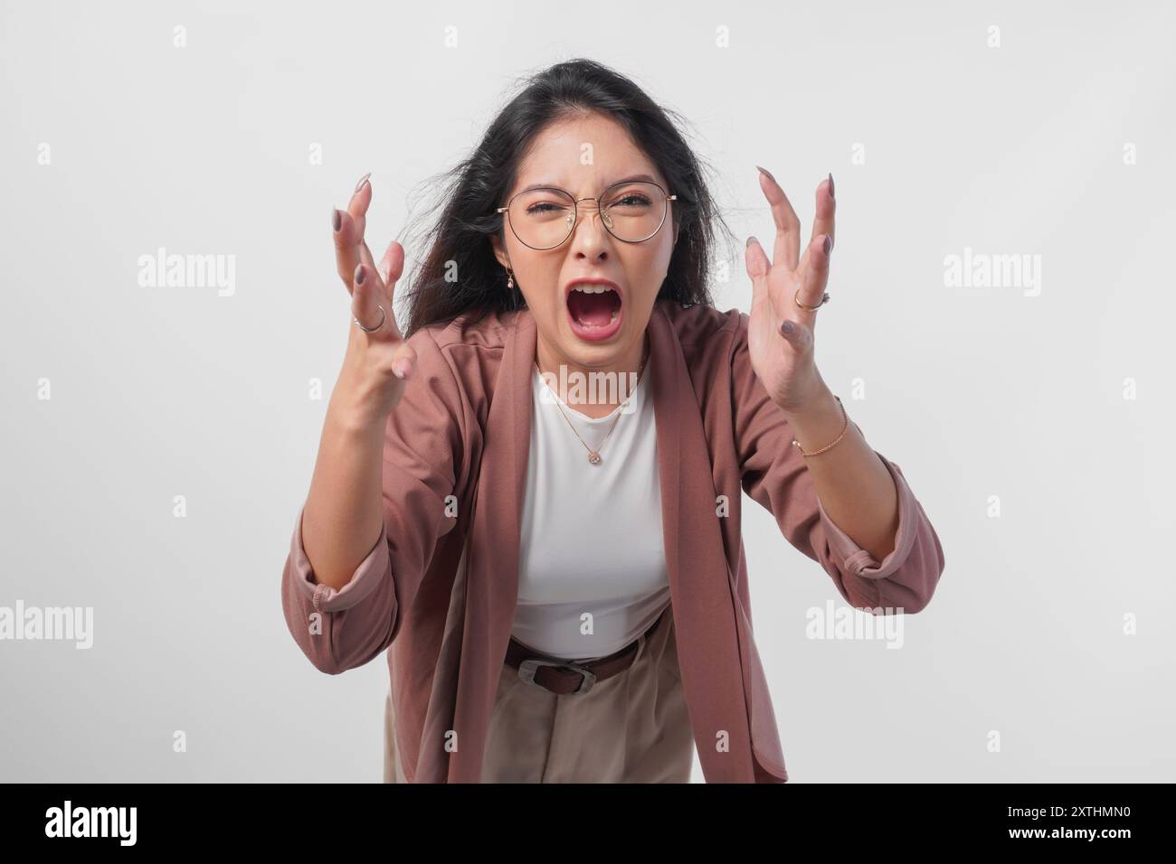 Irritated Asian woman in glasses expressing annoyed, mad, frustrated ...
