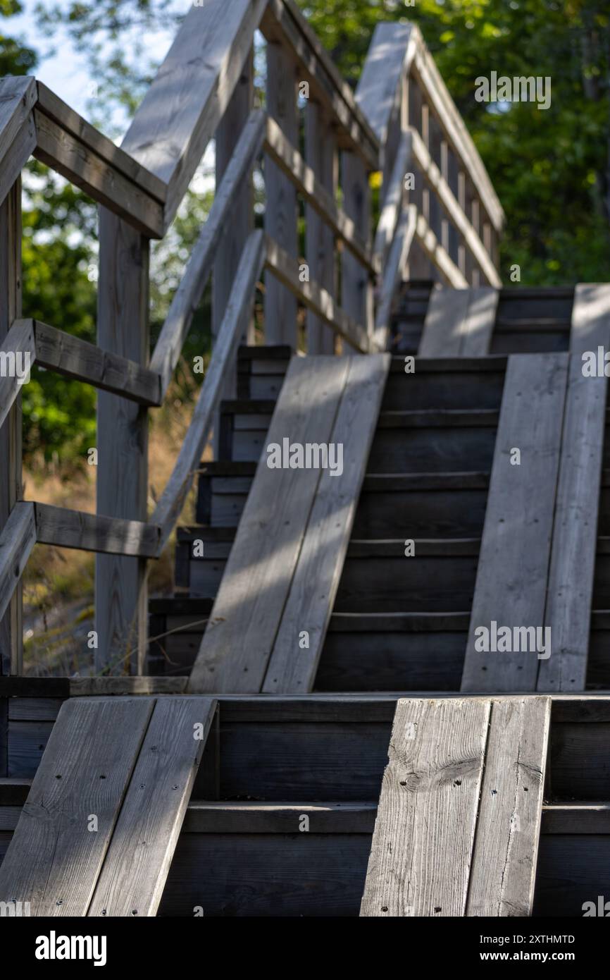 A set of stairs with accessibility aids for disabled people and prams ...