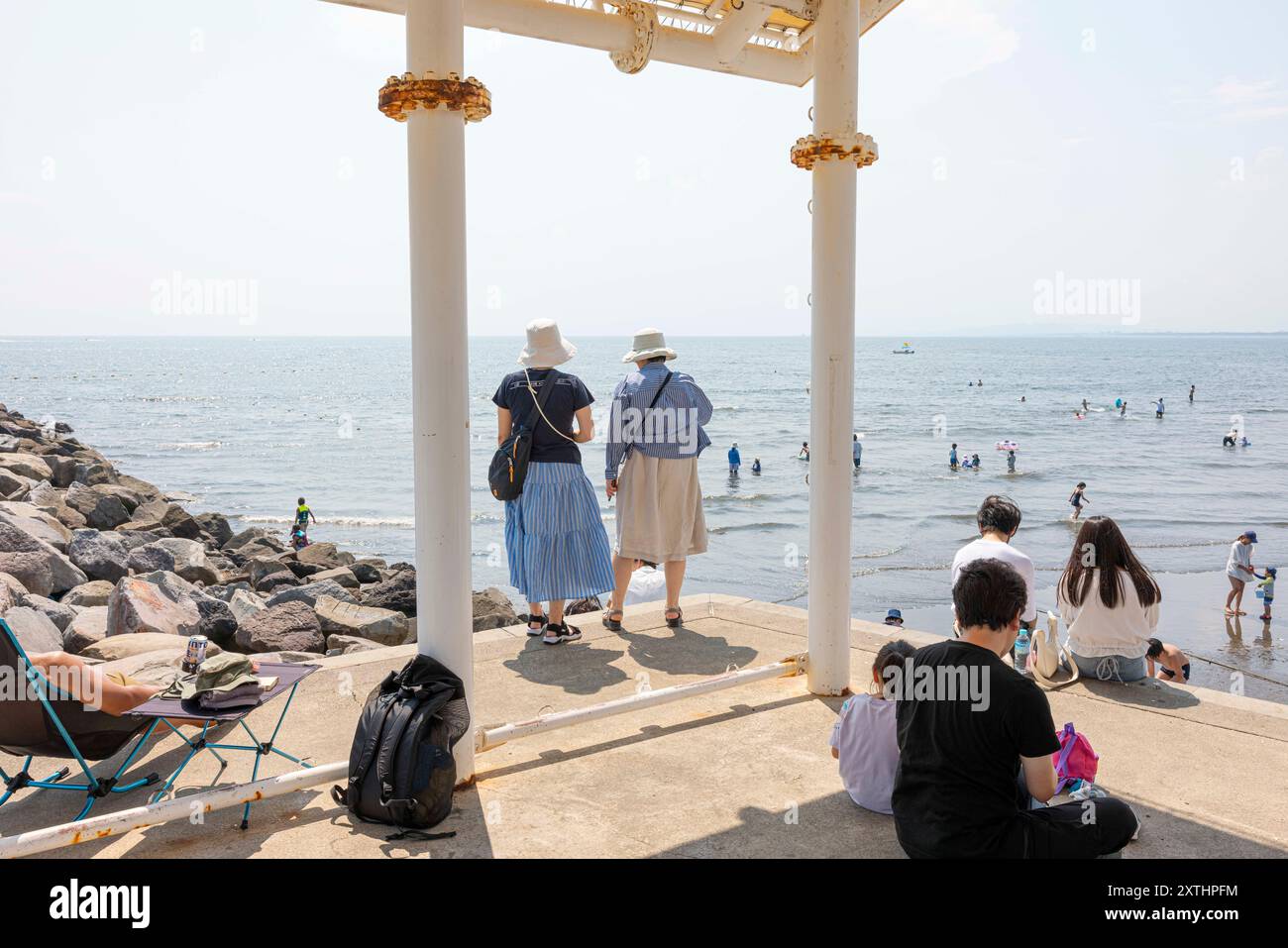 Enoshima, Japan. 08th Aug, 2024. Visitors of Enoshima beach enjoy the ...