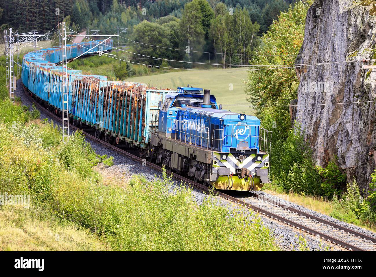 Fenniarail Class Dr18 No. 104 locomotive pulling a long freight train ...