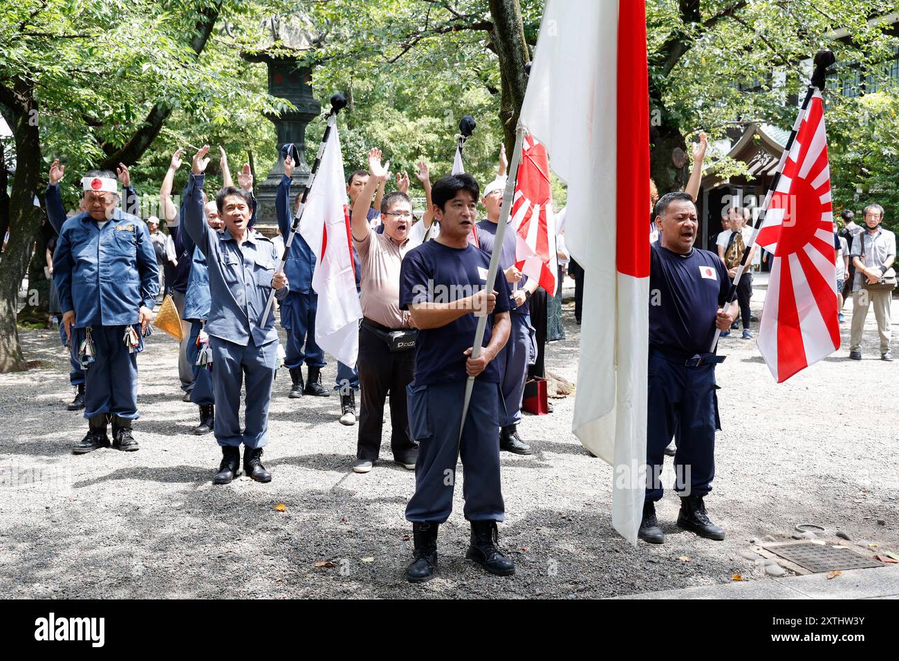 Tokyo, Japan. 15th Aug, 2024. Japanese nationalists hold war flags of ...