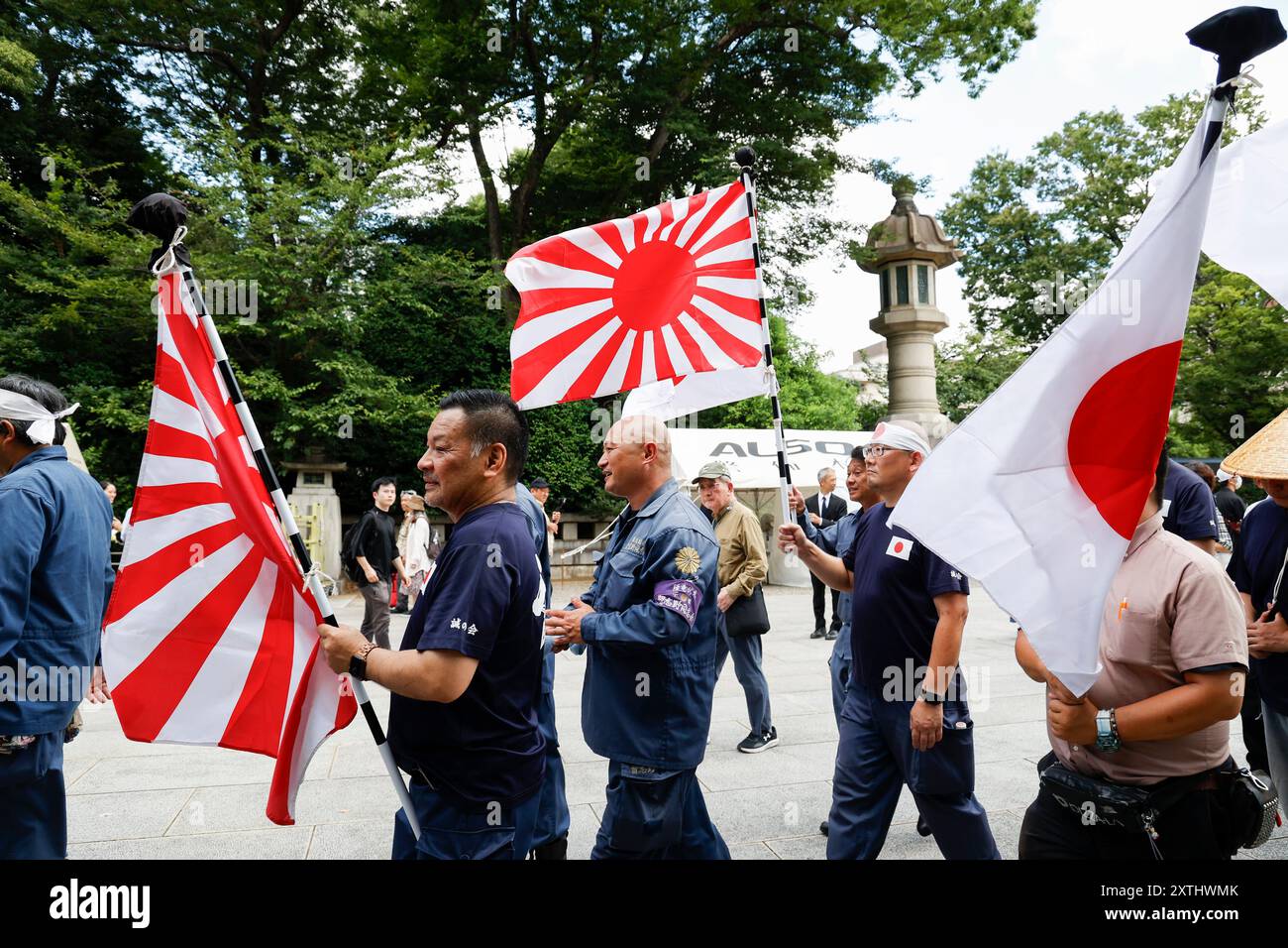 Tokyo, Japan. 15th Aug, 2024. Japanese nationalists holding war flags ...