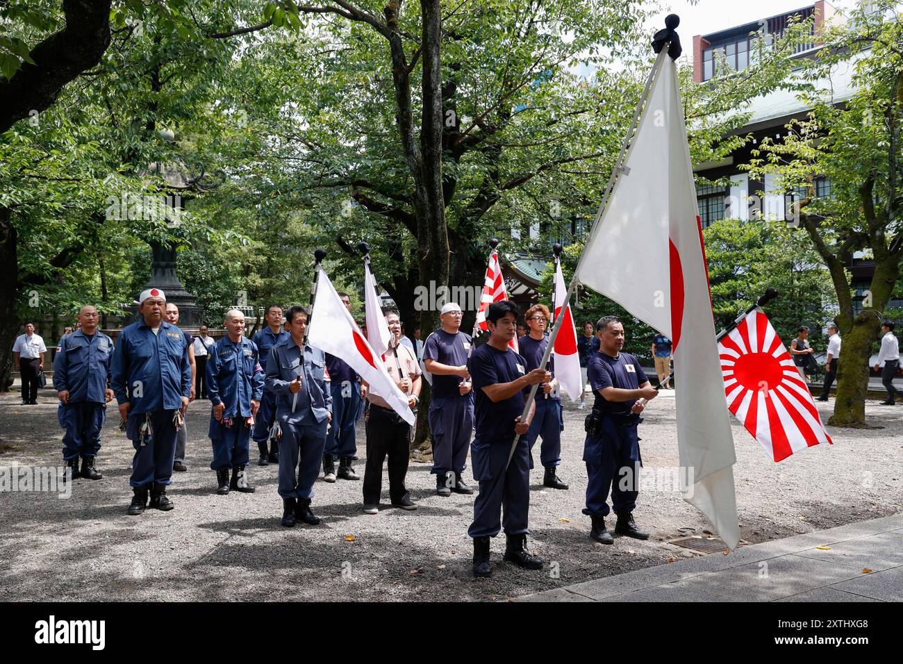 Tokyo, Japan. 15th Aug, 2024. Japanese nationalists holding war flags ...