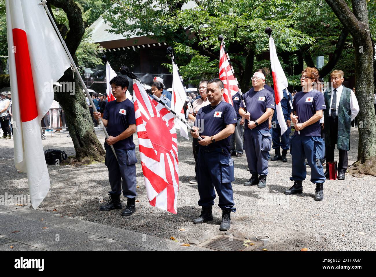Tokyo, Japan. 15th Aug, 2024. Japanese nationalists holding war flags ...