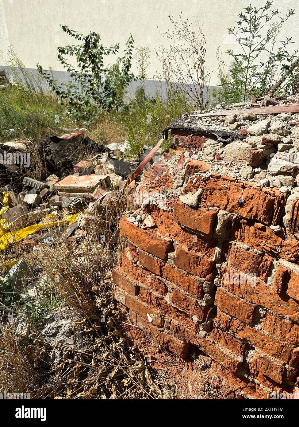 Brick wall of a demolished old building Stock Photo - Alamy