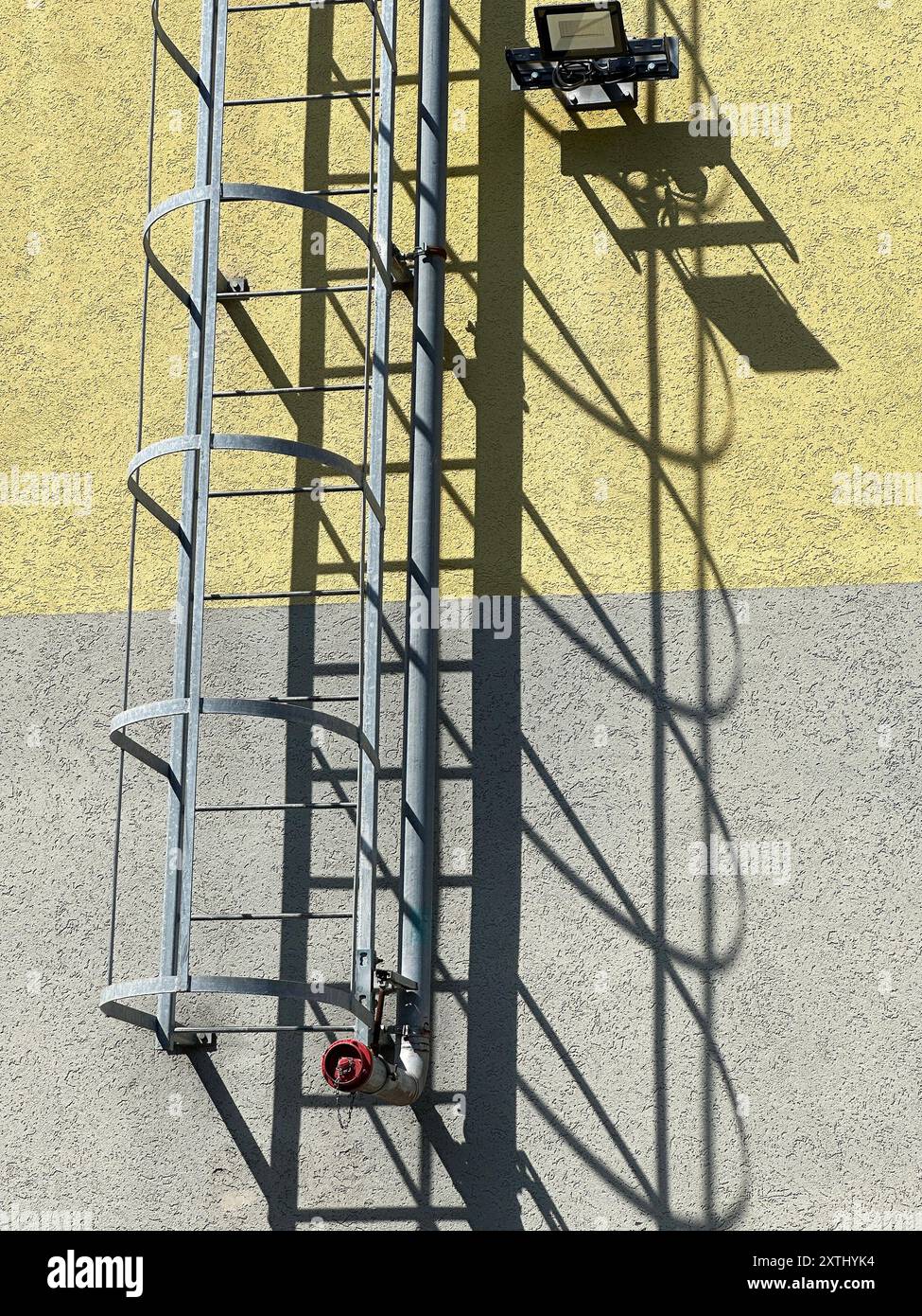 Ladder on the wall of the warehouse building Stock Photo - Alamy