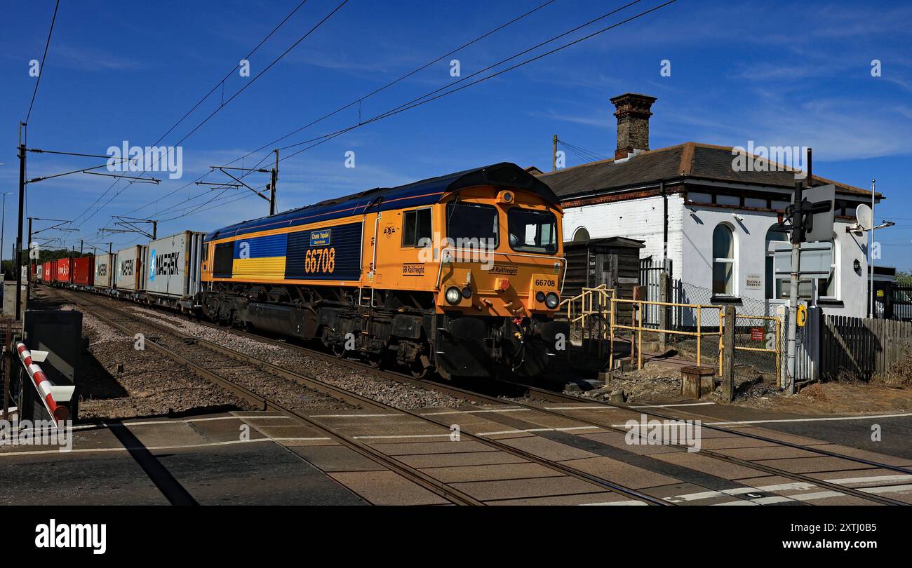 GBRF diesel locomotive no 66708 passes over the level crossing and ...
