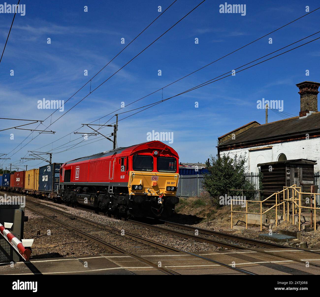 DB Cargo diesel locomotive no 66207 with a freight train passes over a ...
