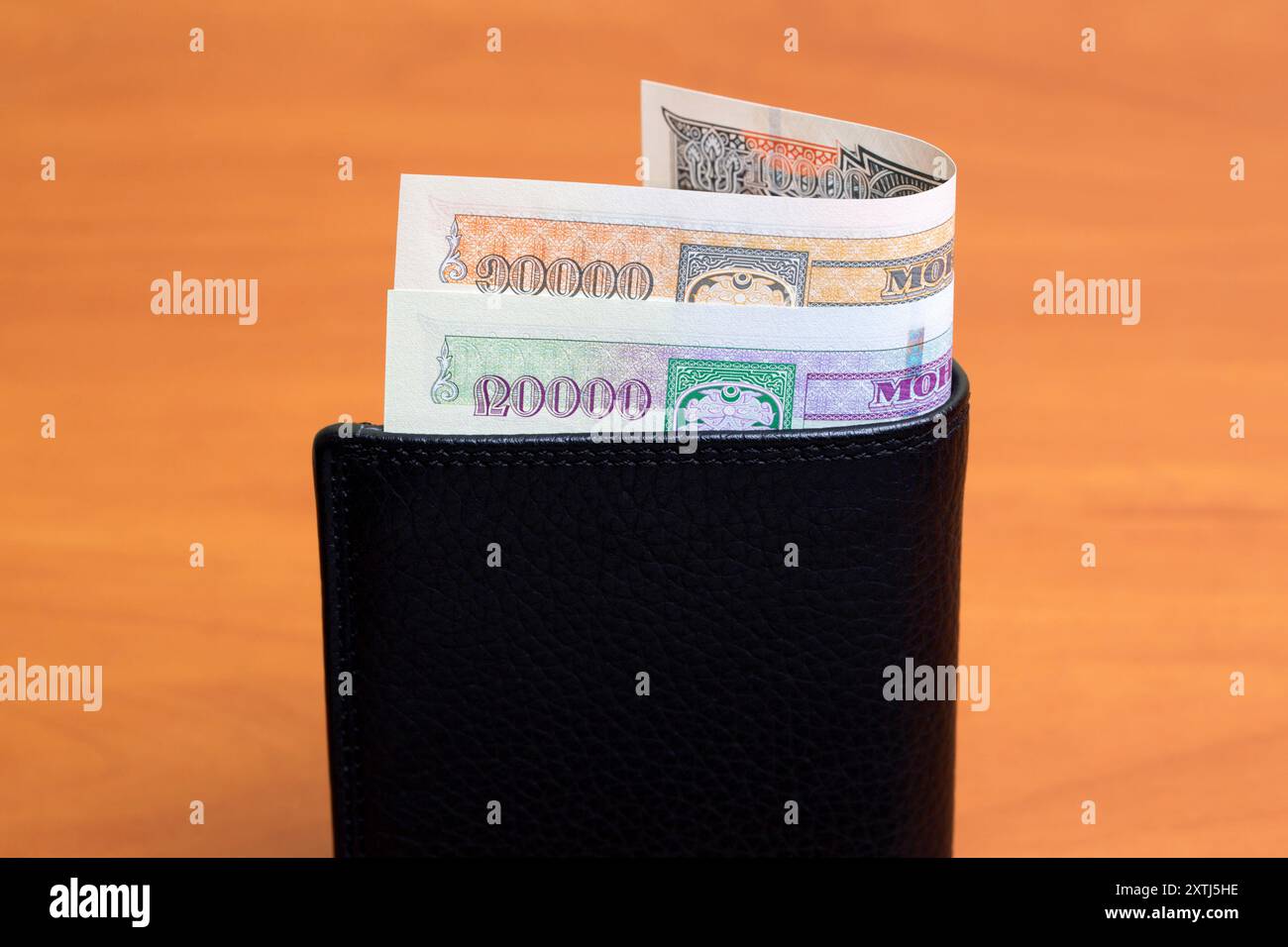Mongolian money - tugrik in the black wallet Stock Photo - Alamy
