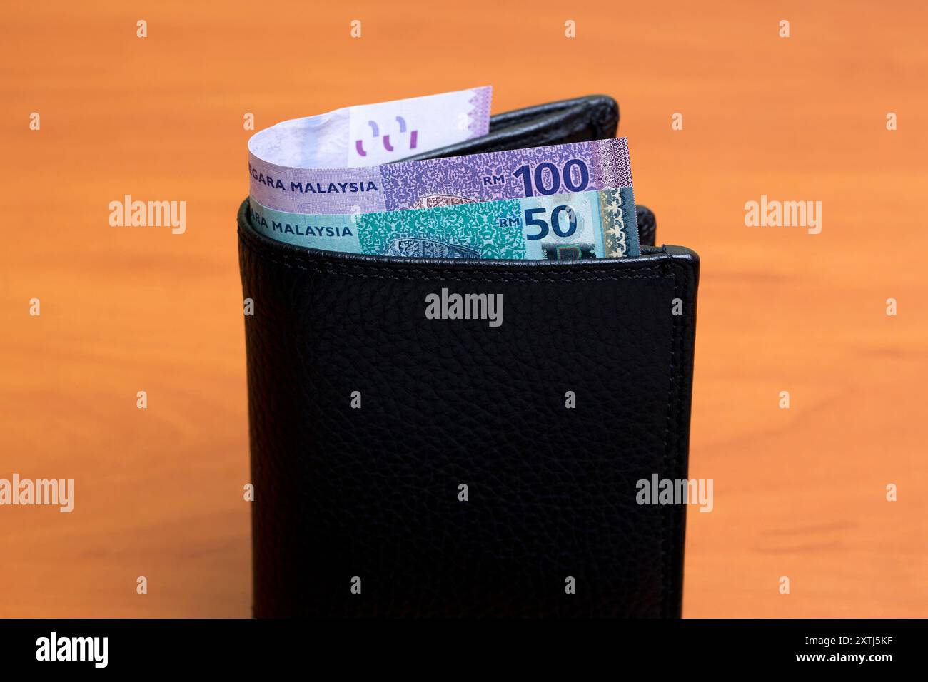 Malaysian money - ringgit in the black wallet Stock Photo - Alamy