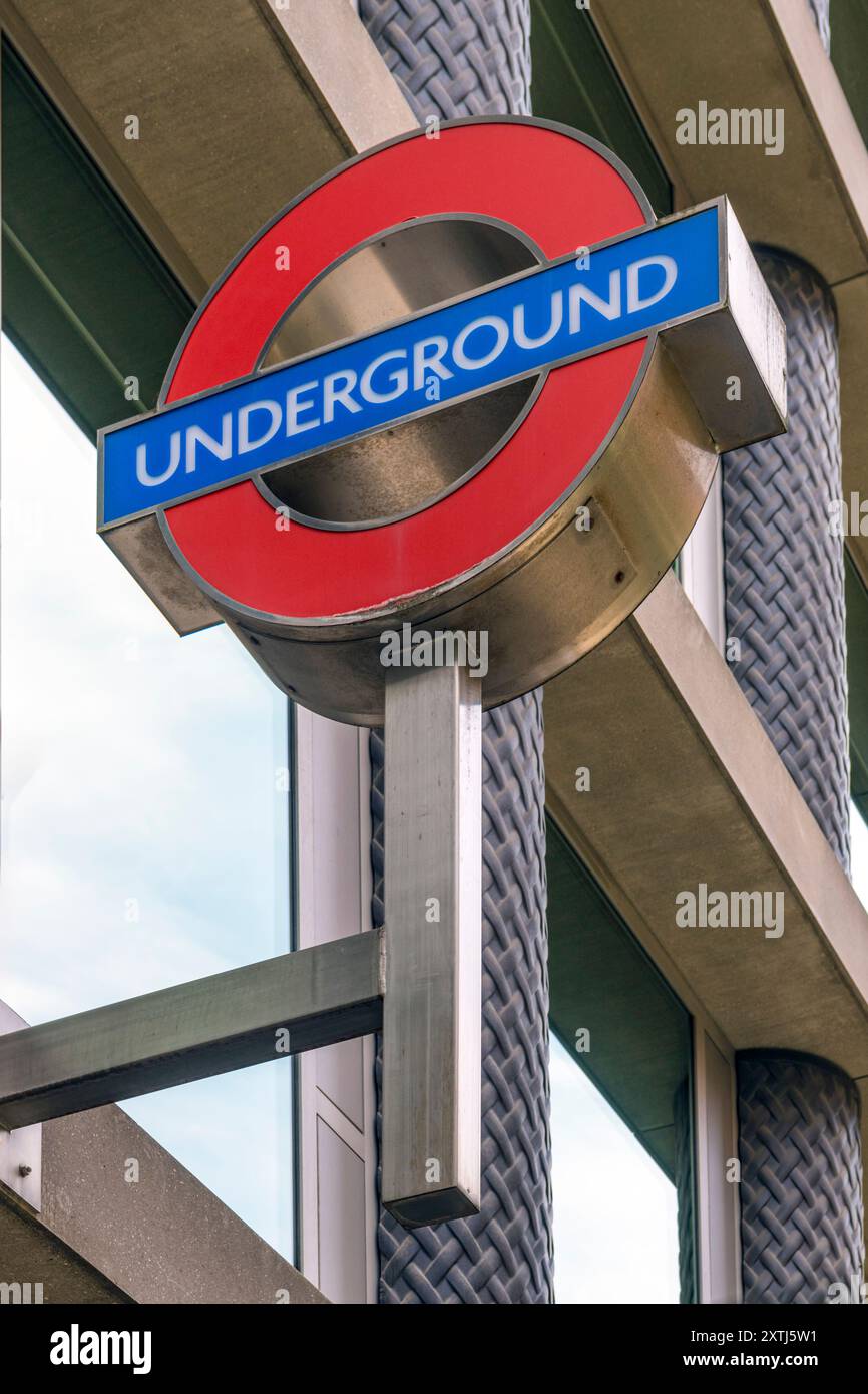 London Underground logo mounted on side of building Stock Photo - Alamy
