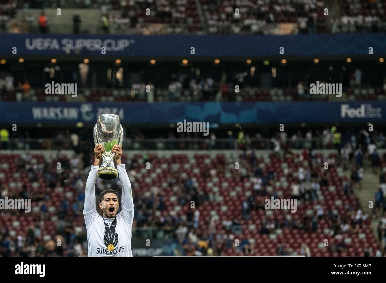 Jude Bellingham is celebrating and raising the cup after the victory of ...