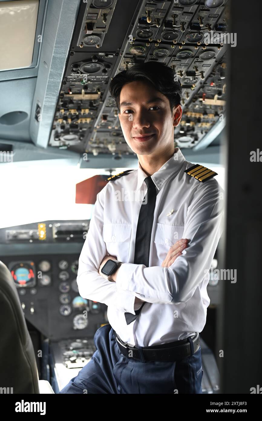 Transportation smiling pilot expertise aircraft standing hi-res stock ...