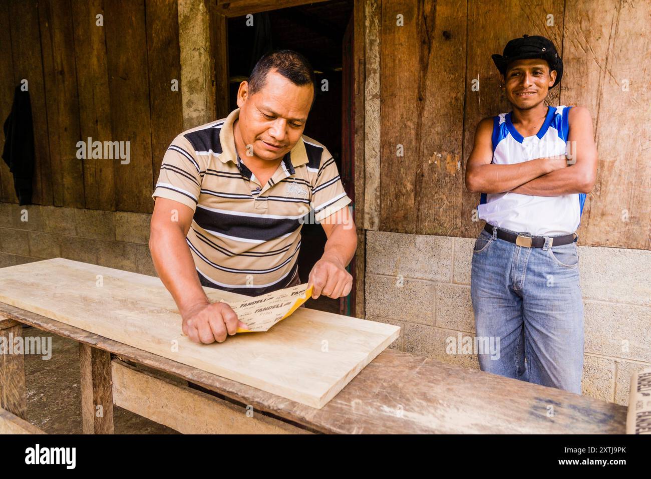 Carpenter repairing a hut, village of Panama, near La Parroquia ...