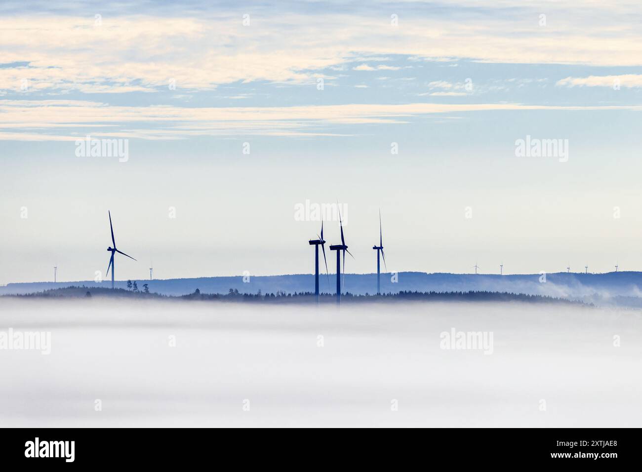 Wind power above the mist Stock Photo - Alamy