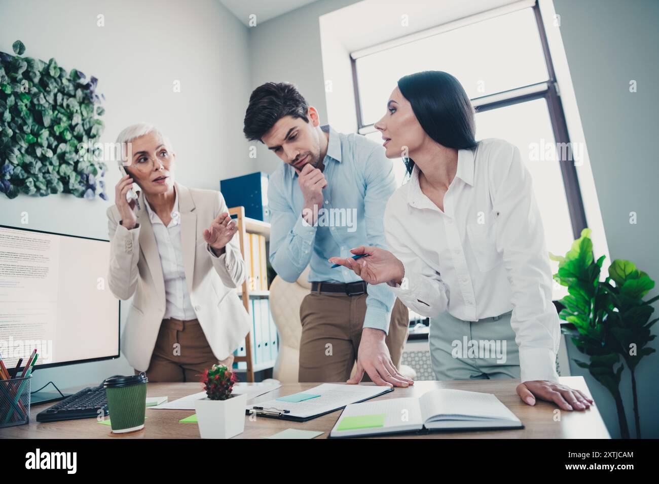 Photo of two employees mature boss woman discuss contract minded ...