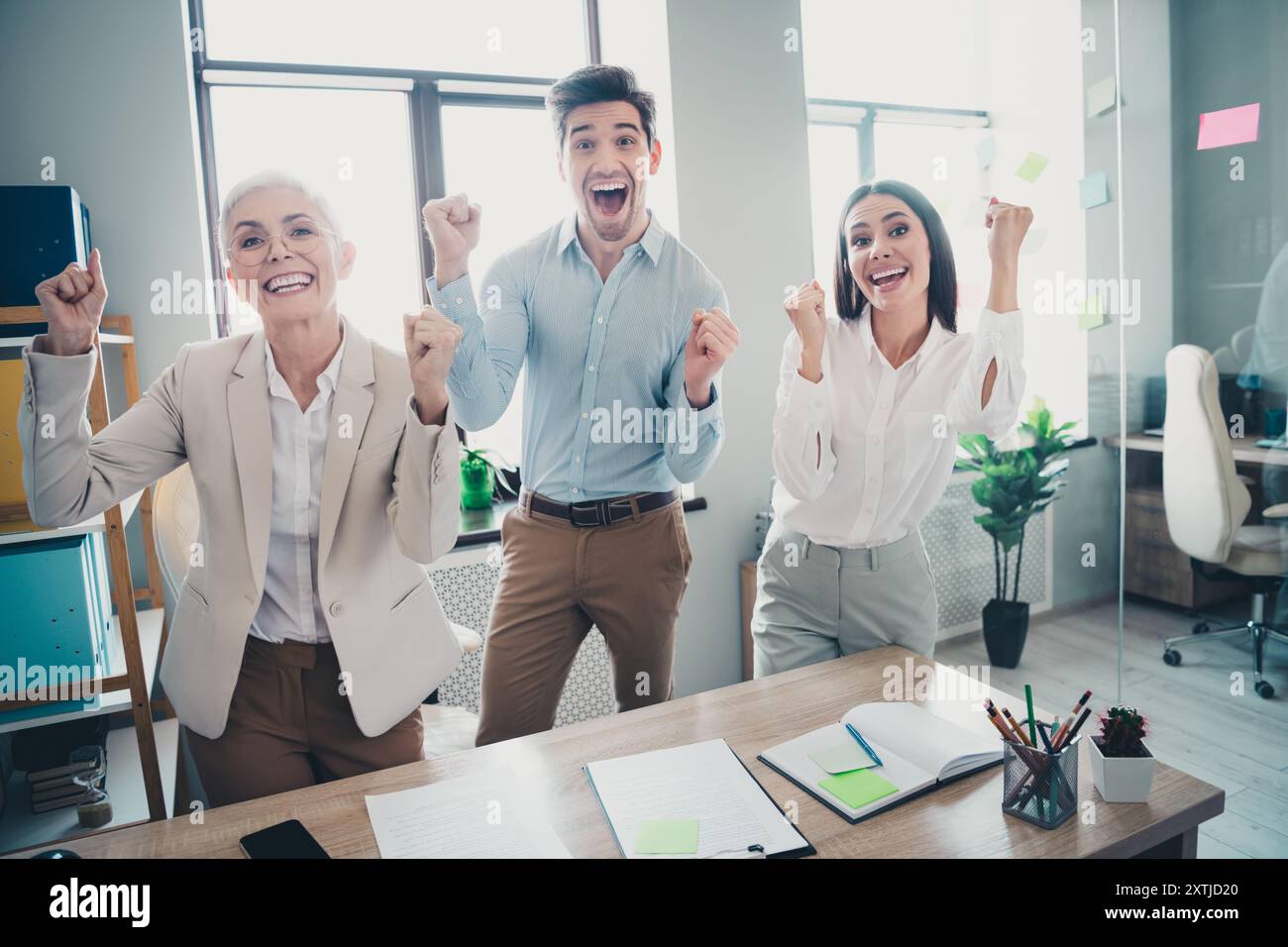 Photo of two employees mature boss woman winning office team meeting ...