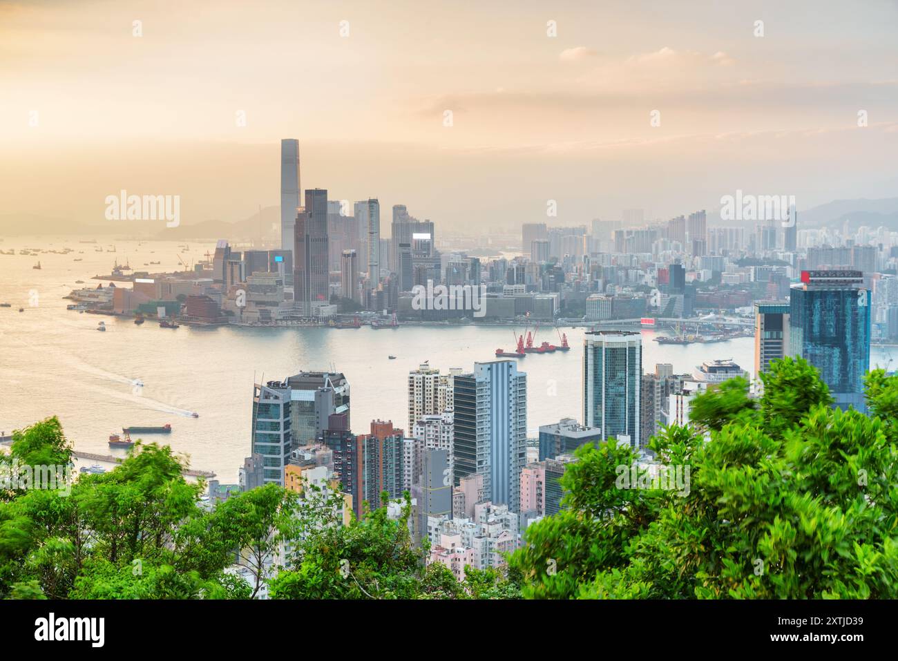 Awesome view of Victoria harbor and Kowloon at sunset Stock Photo - Alamy