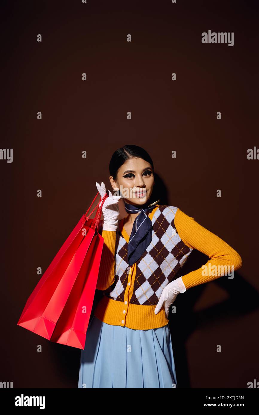 Stylish woman shopper poses red hi-res stock photography and images - Alamy