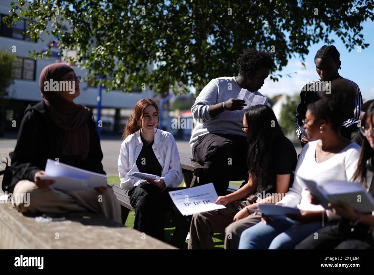 Students sit together after receiving their A-level results at Ark ...