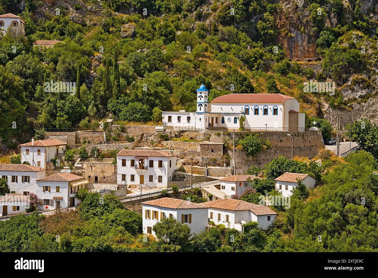 The picturesque greek style village of Dhermi at the coastal road of ...