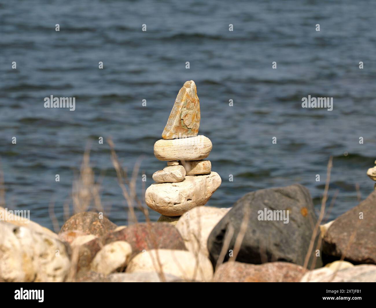 Stacked stones to form towers and figures on the beach are popular ...