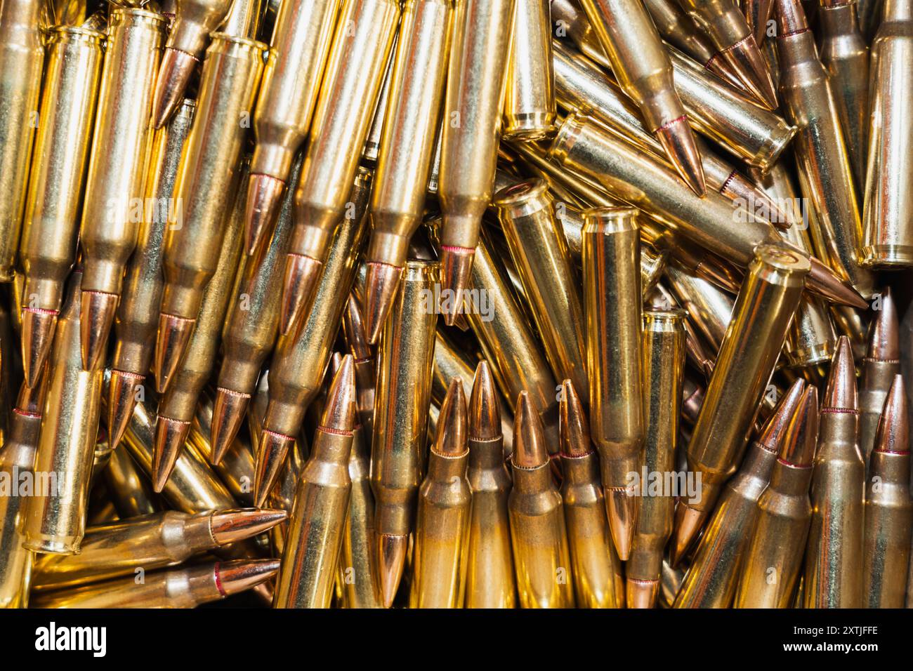 Photo background texture, close-up of 5.56x45mm caliber cartridges ...