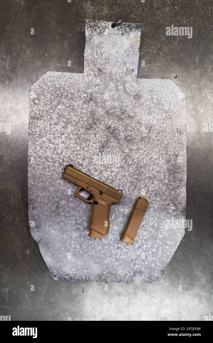 Shooting at a shooting range, an iron target in the shape of a body and ...