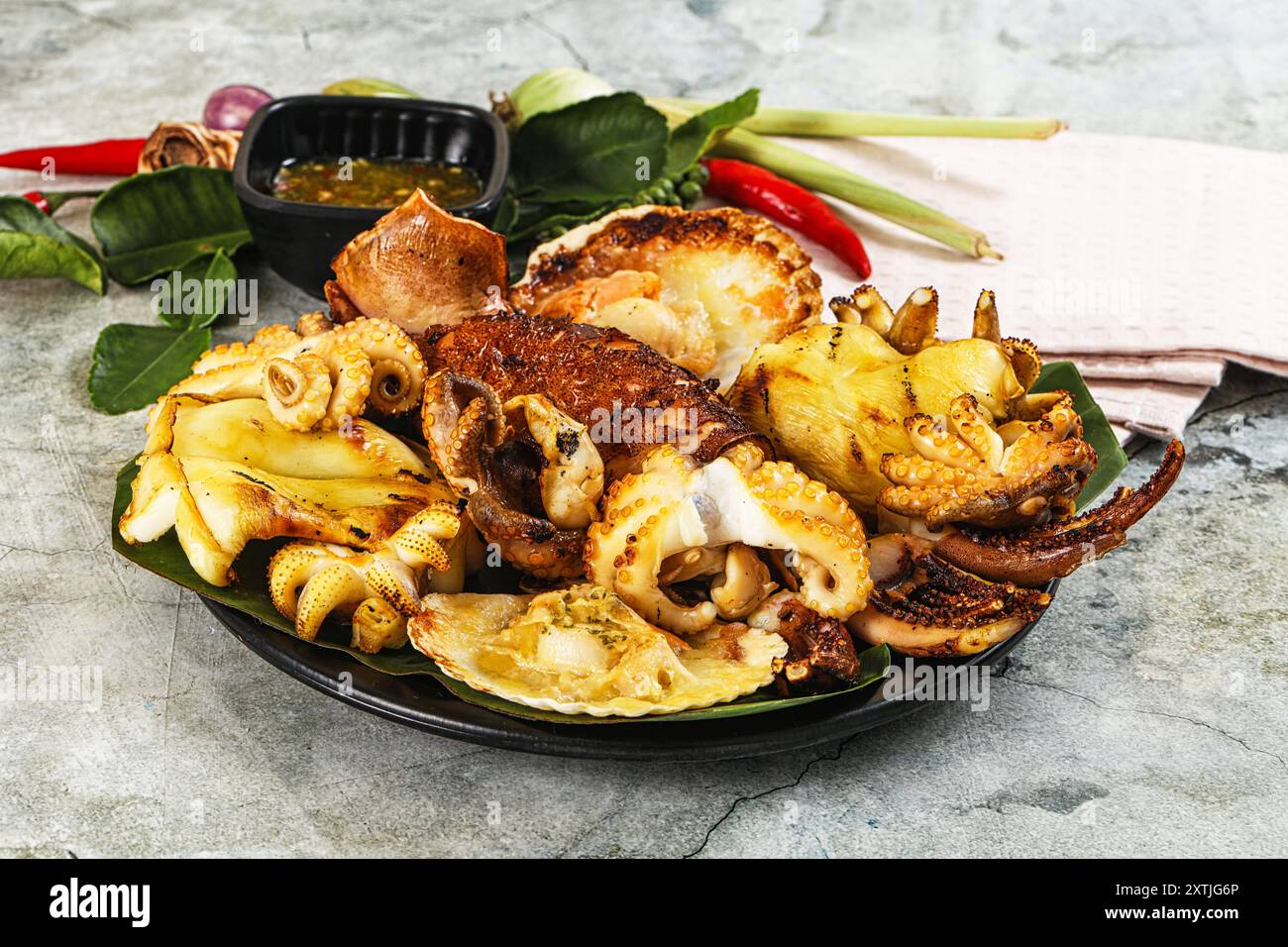 Asian grilled seafood mix plate - squid, cuttlefish, scallops and ...