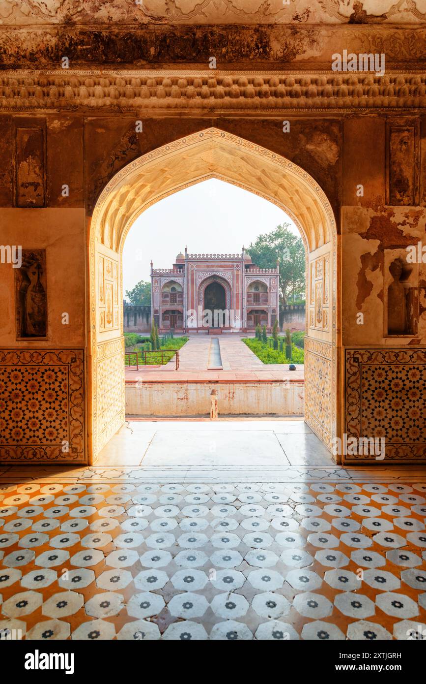 Awesome view of red sandstone building through arched gate Stock Photo ...