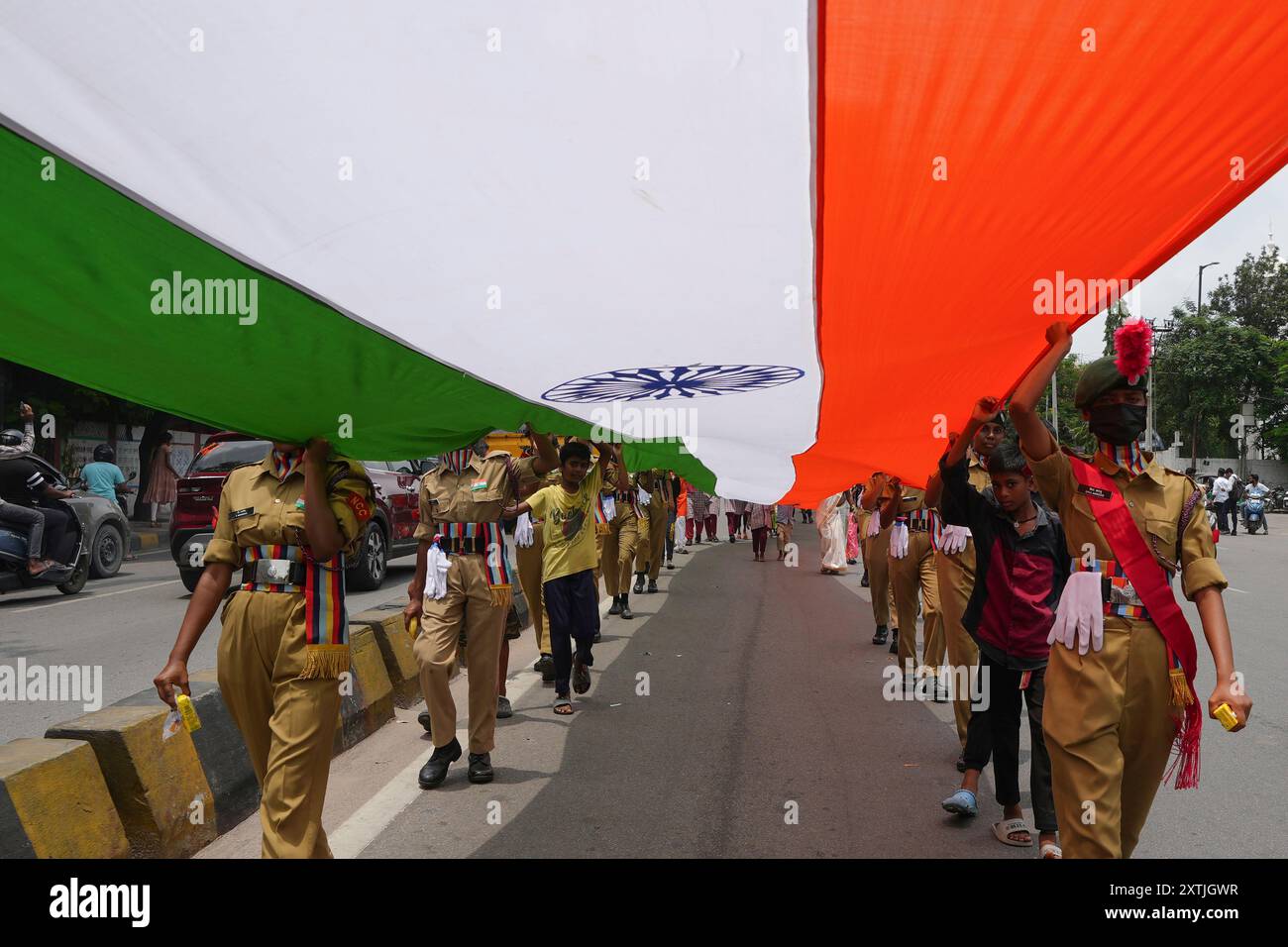 People participate in a rally holding a giant Indian flag during ...