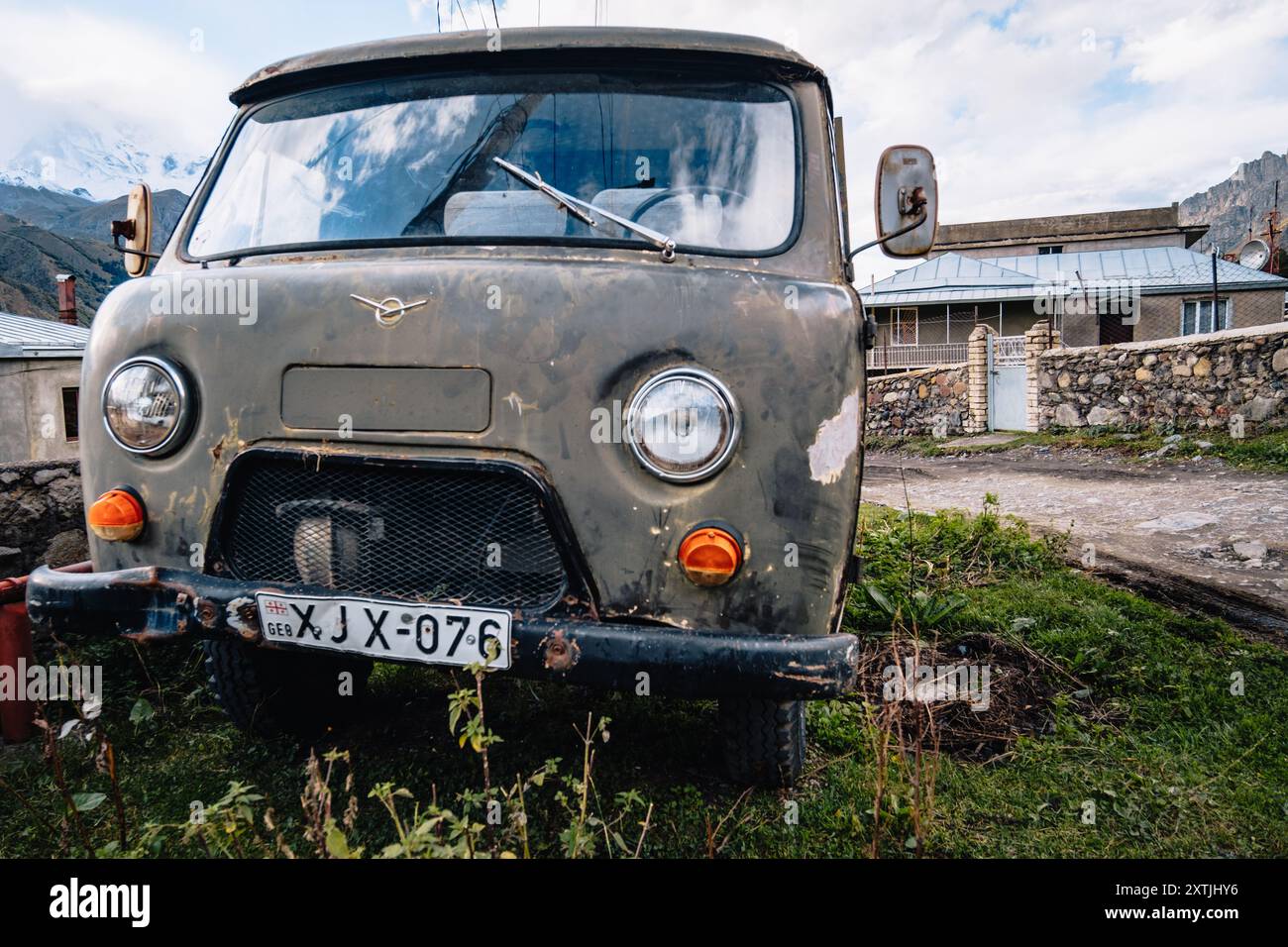 View of an old and rusty UAZ van from the soviet era in the mountain ...