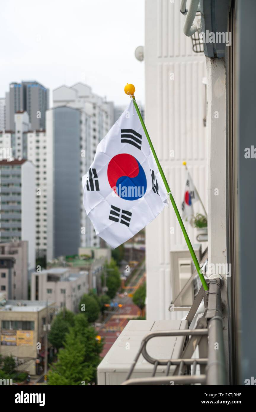 Taegeukgi hanging on the exterior wall of an apartment on National Day ...