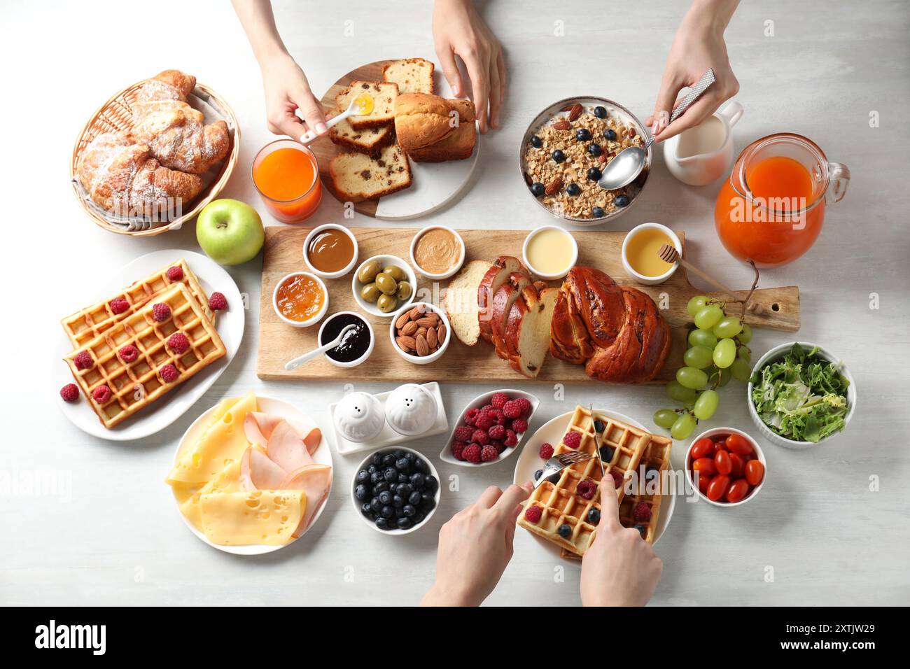 People having breakfast at white table, top view Stock Photo - Alamy