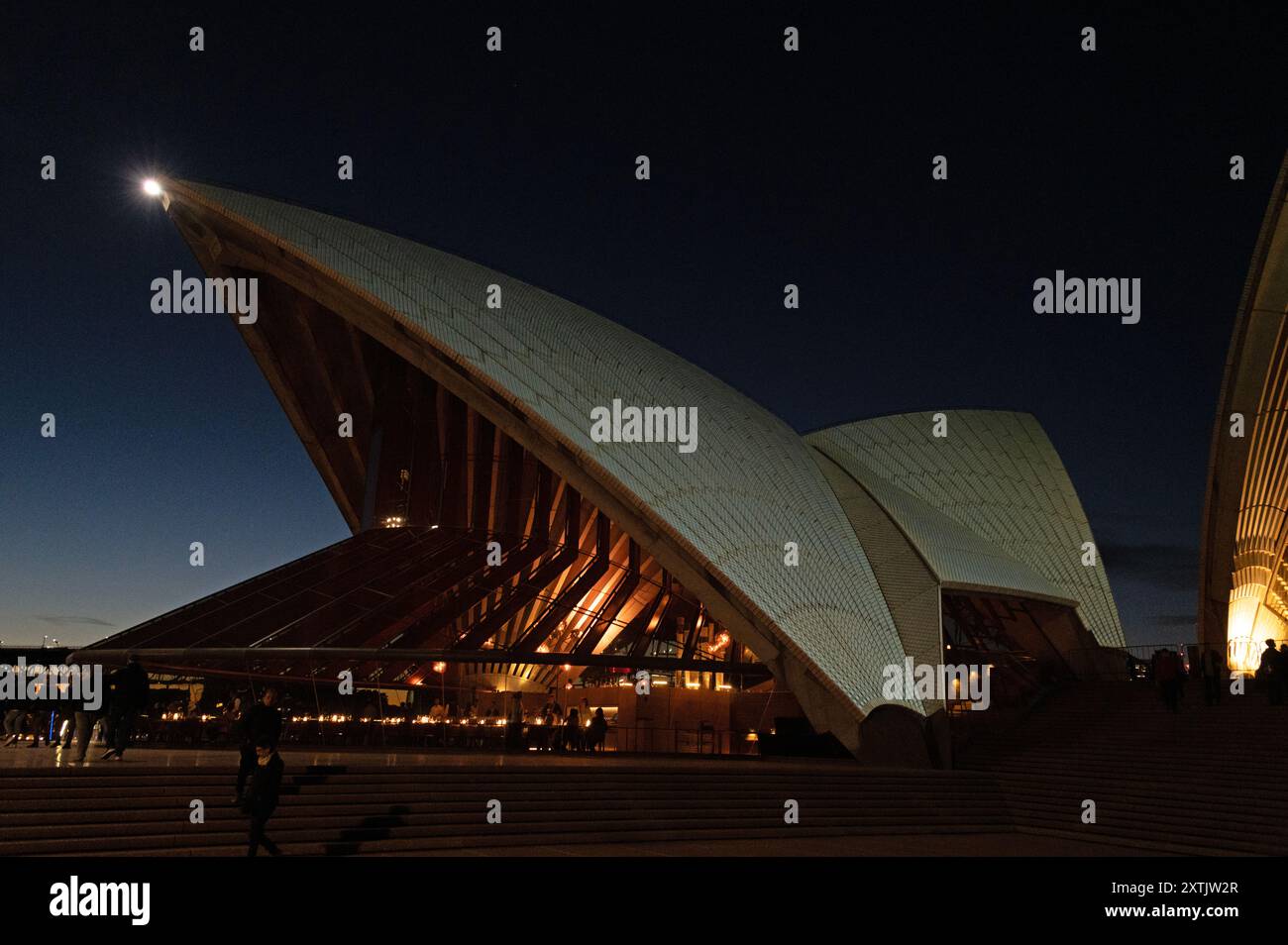 One of Sydney’s landmarks is the Opera House at autumn dusk in Sydney ...