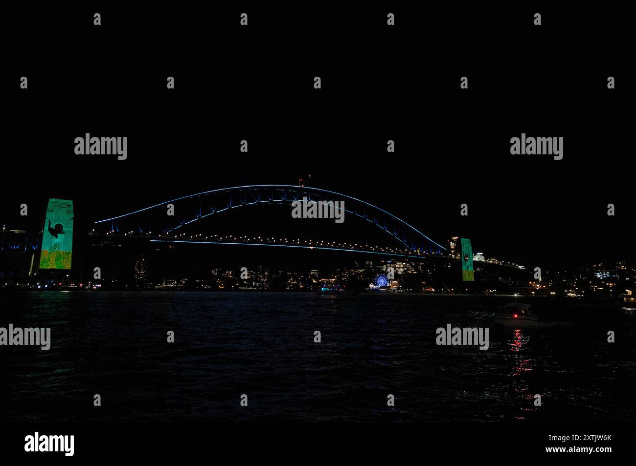 Sydney’s landmark of the Harbour Bridge lit-up with coloured lazar ...
