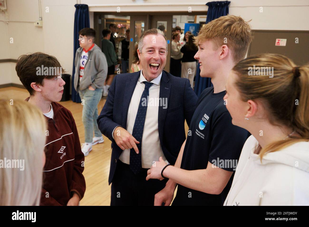 Education Secretary Paul Given (centre) joins students at Belfast High ...
