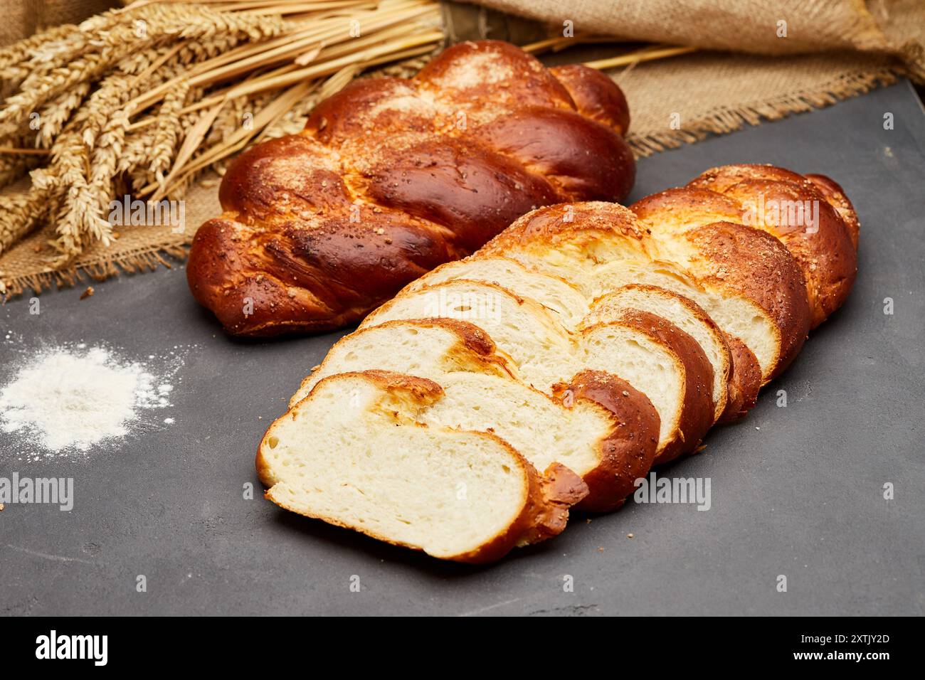 Braided sweet bread loaf sliced, showcasing its golden crust and soft ...