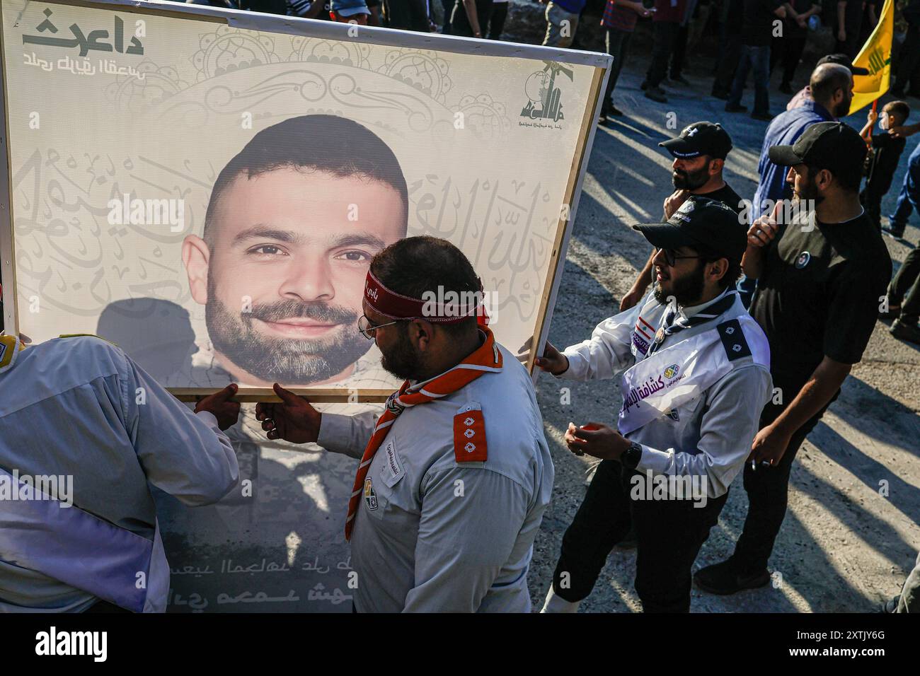 Baraachit, Lebanon. 14th Aug, 2024. Hezbollah supporters carry a ...