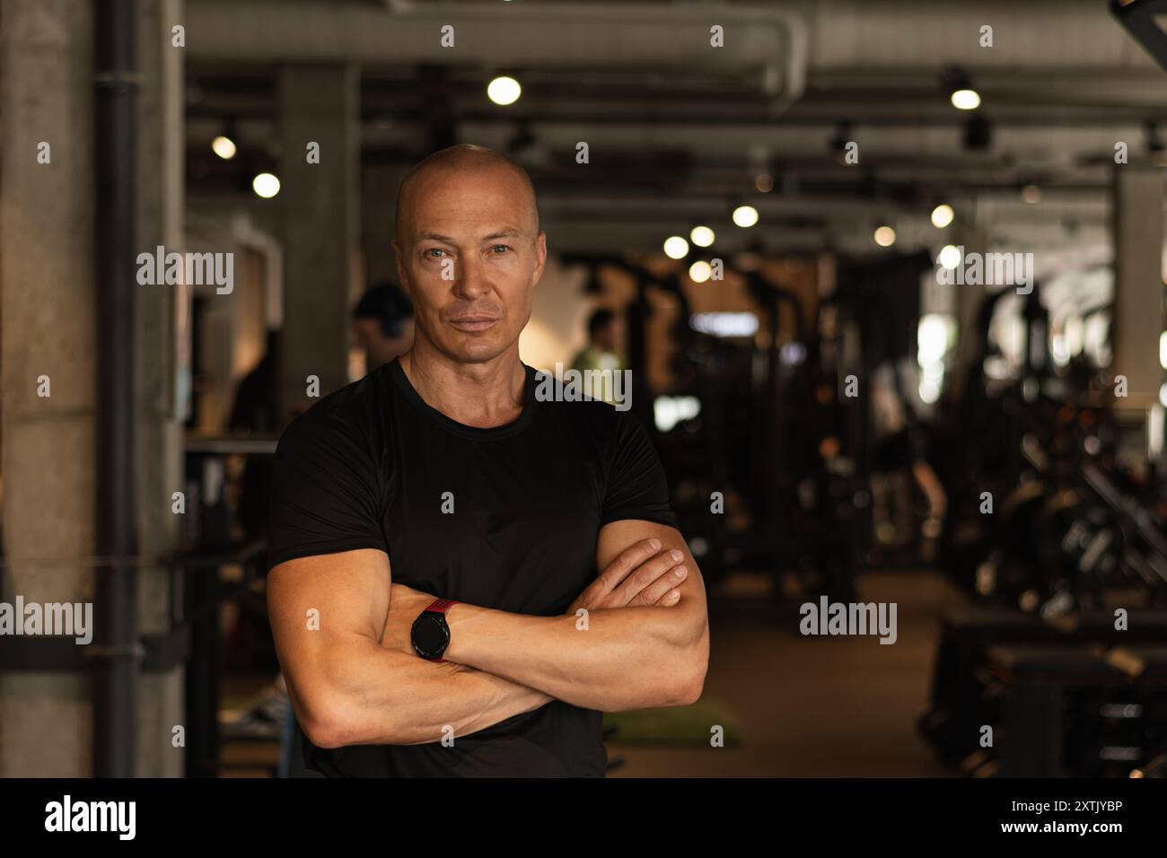 Bald handsome sportsman wearing black hi-res stock photography and ...