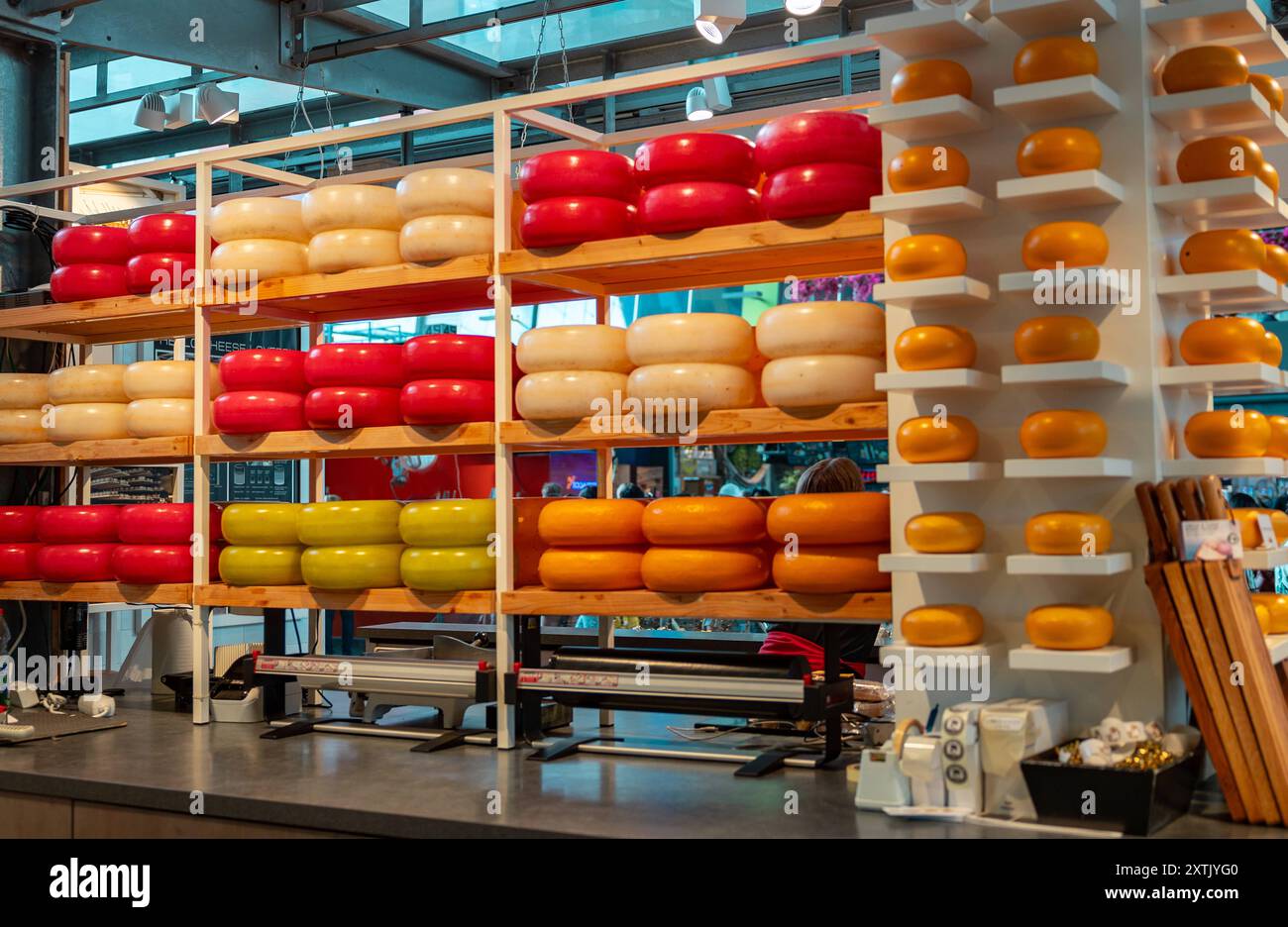 Selection of Dutch cheese at a stall in the market hall in Rotterdam ...