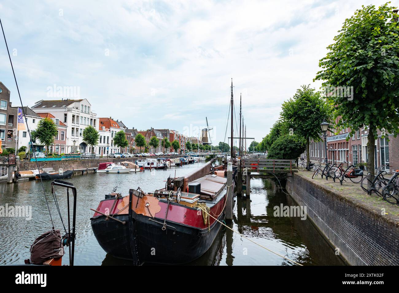 View along the Delfshaven, ships with sailing masts at anchor ...