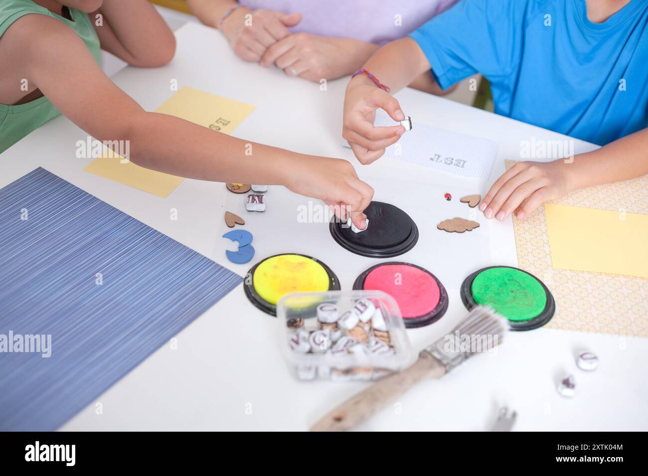 Children hands with brush hi-res stock photography and images - Alamy