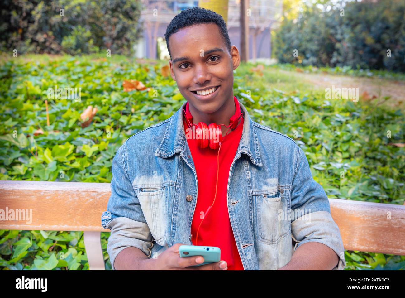 Happy student African American man browsing the internet using a mobile ...