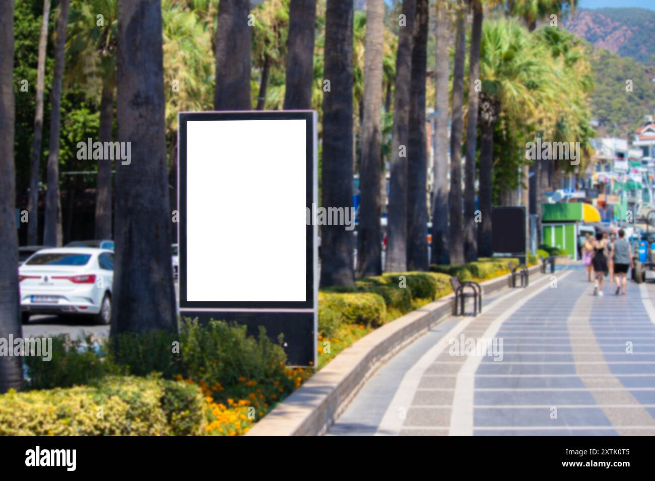 Vertical blank white billboard on the roadside. Illuminated billboard ...